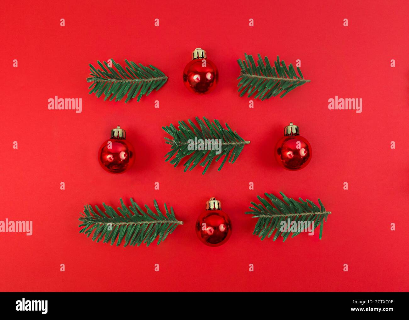 Christmas symmetry composition from toy baubles and fir tree branches ...