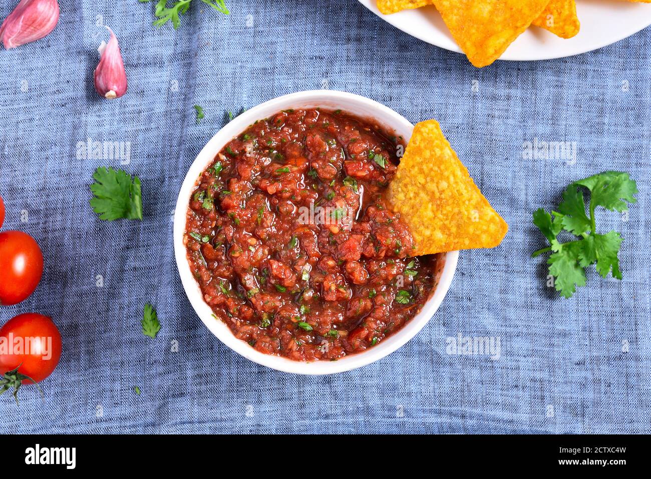 Tomato salsa in bowl. Top view, flat lay Stock Photo - Alamy