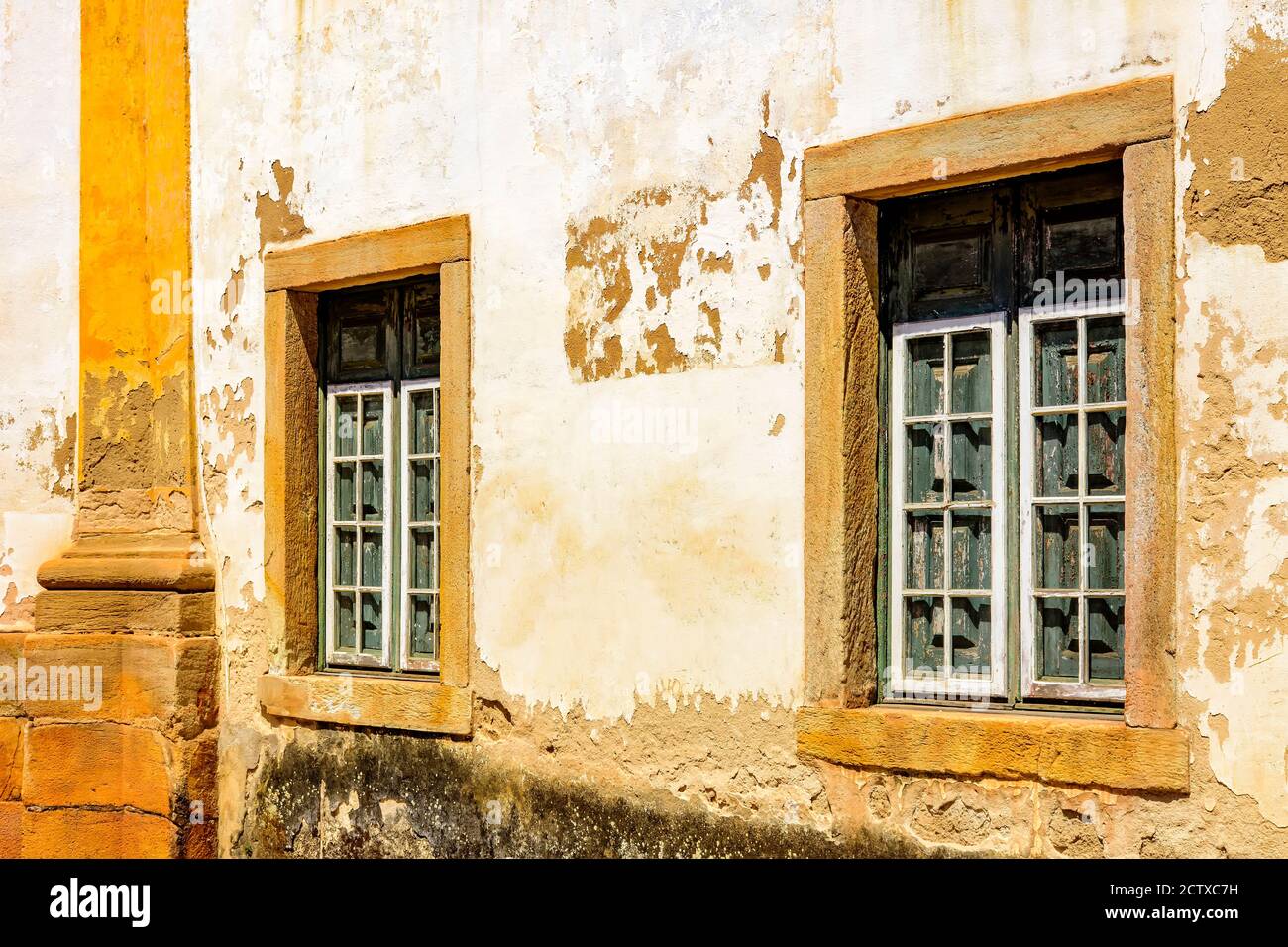 Historic church windows in colonial style with rustic stone frame in ...