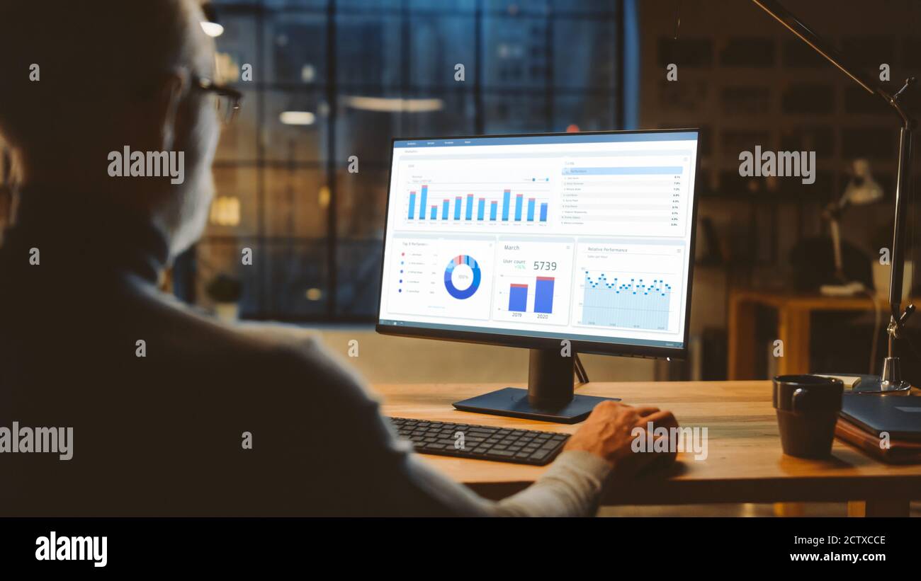 Over the Shoulder Confident Middle Aged Business Man Sitting at His ...
