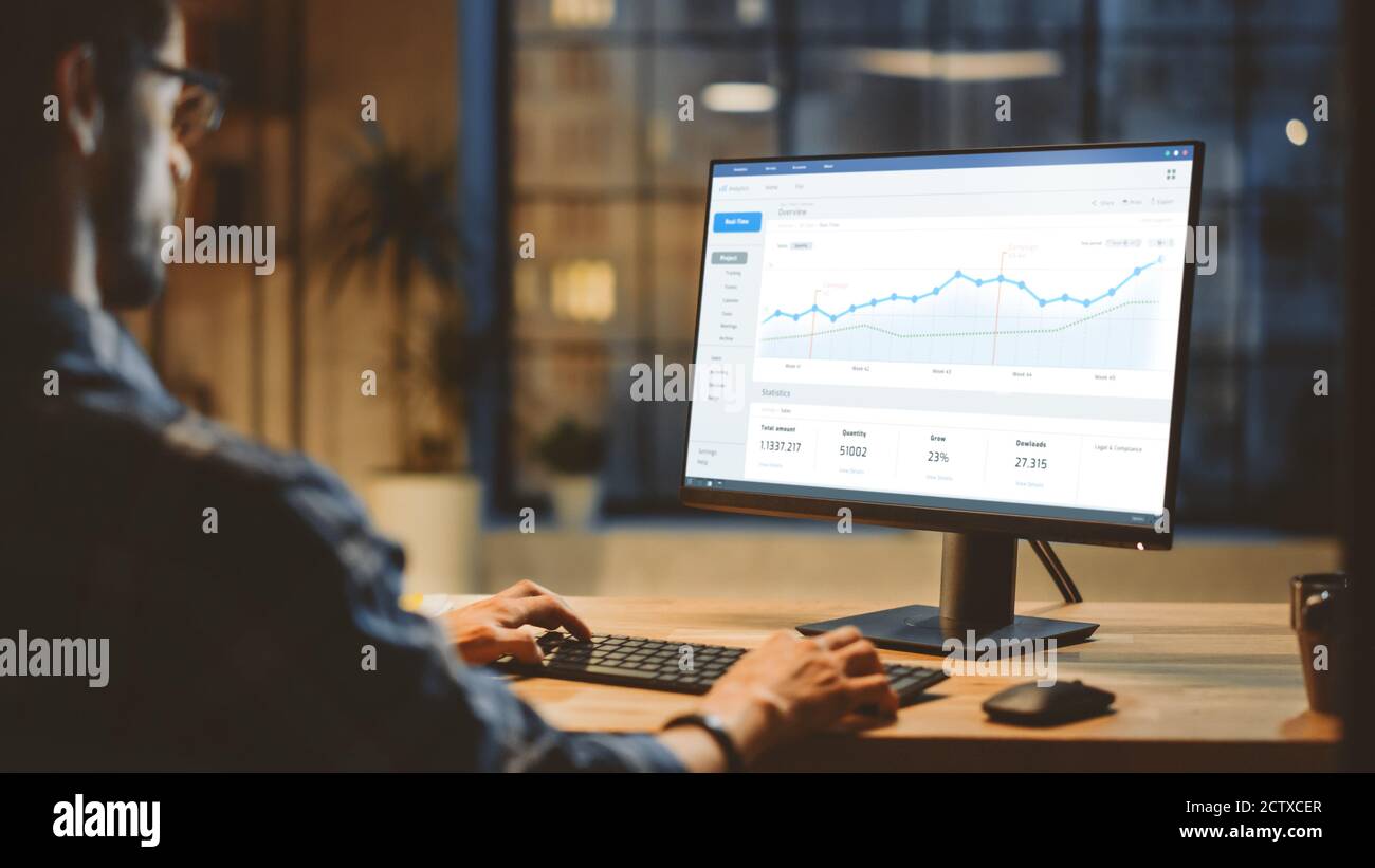 Over the Shoulder Confident Young Business Man Sitting at His Desk ...