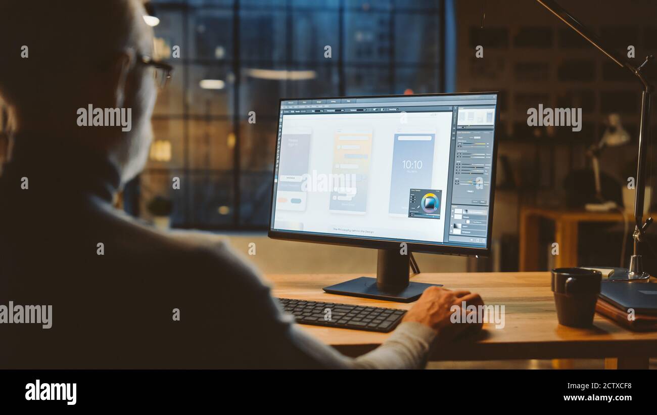 Over the Shoulder Shot of a Confident Middle Aged App Developer Using ...