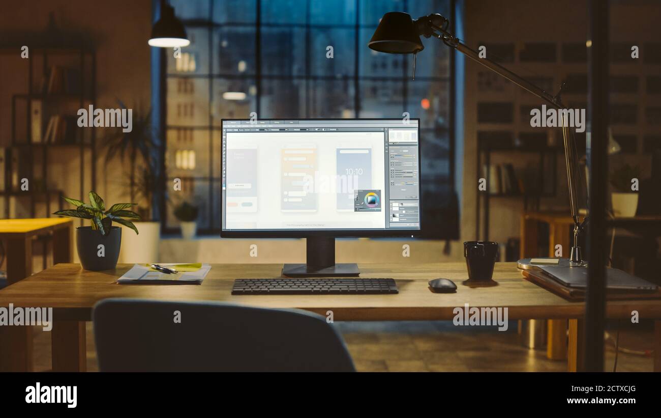 Shot of a Desktop Computer in the Office Shows Screen with Mobile Phone ...