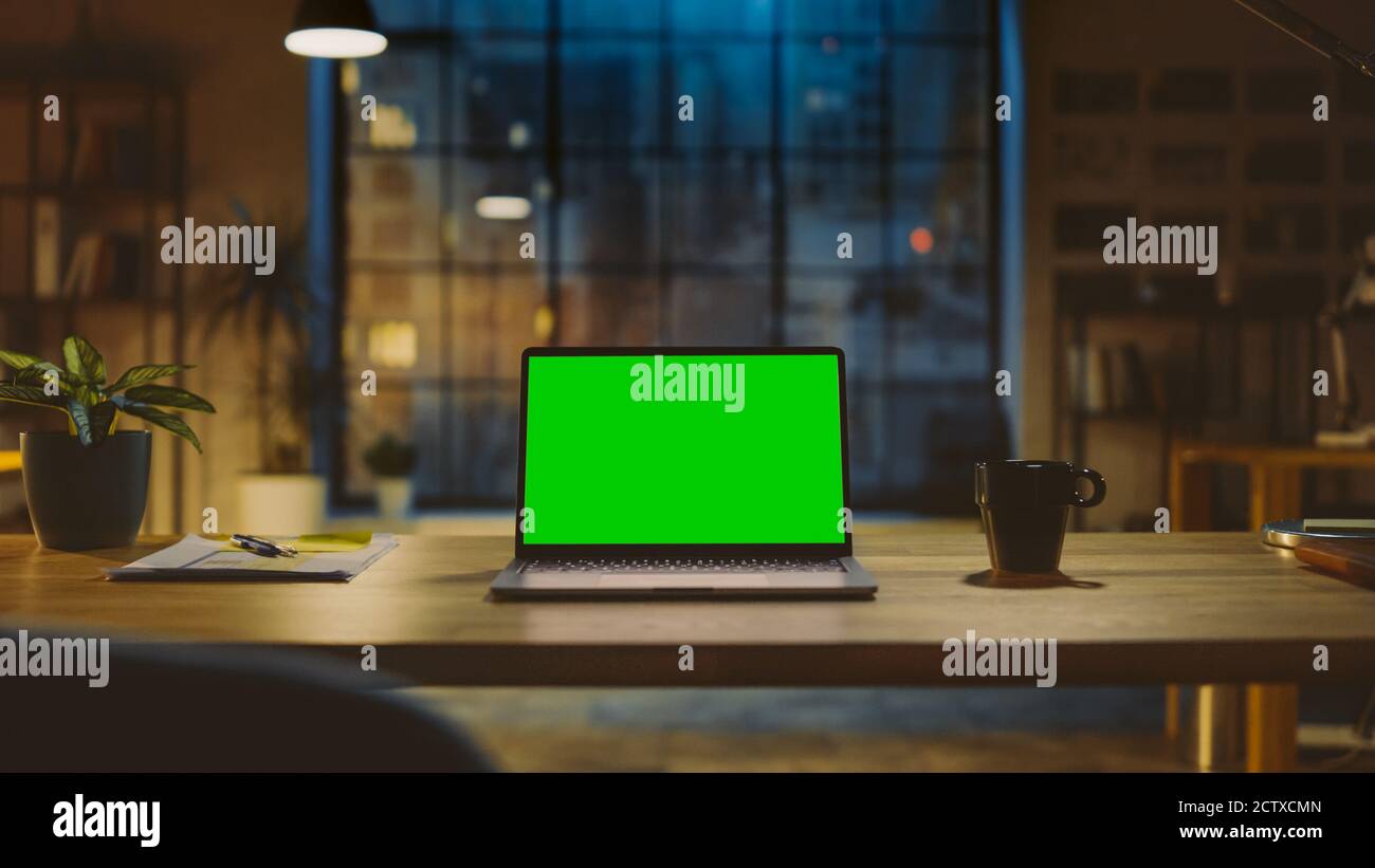 Mock-up Green Screen Laptop Standing on the Desk in the Modern Creative ...