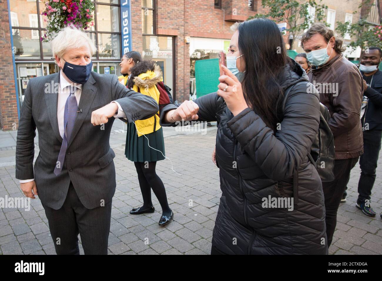 Prime Minister Boris Johnson meets shoppers and shopkeepers during a ... Prime Minister Boris Johnson meets shoppers and shopkeepers during a ...