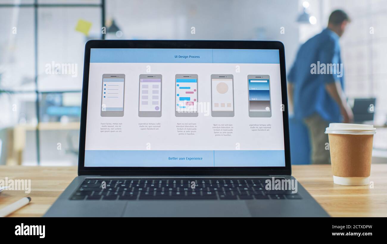 Laptop on the Desk in the Office Shows Screen with Mobile Phone ...