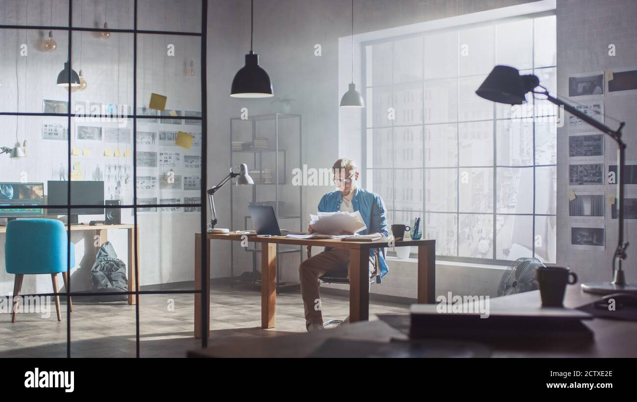 Shot of a Young Creative Designer Works on Laptop at His Desk, He ...