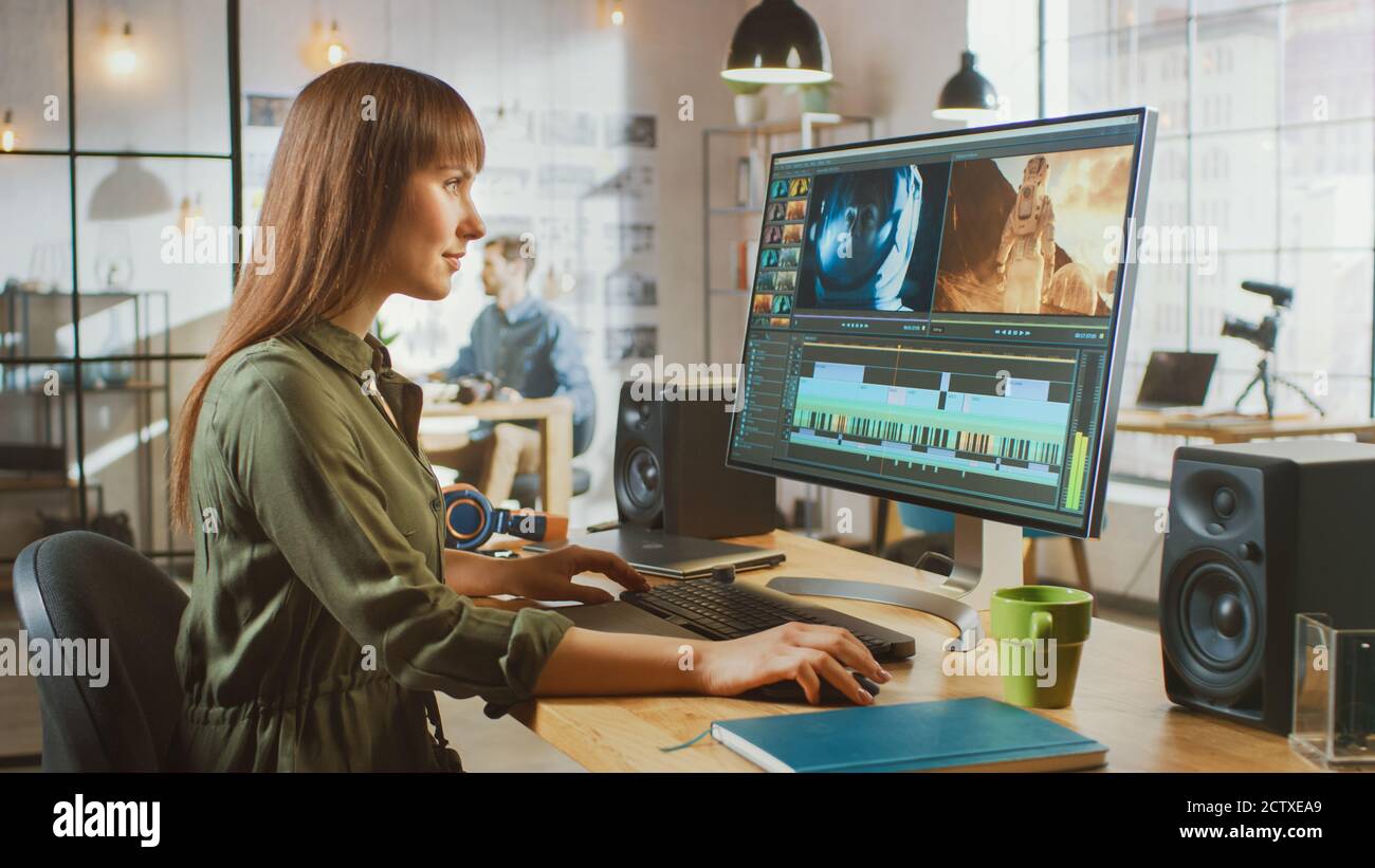 Beautiful Brunette Female Video Editor Works with Footage on Her ...