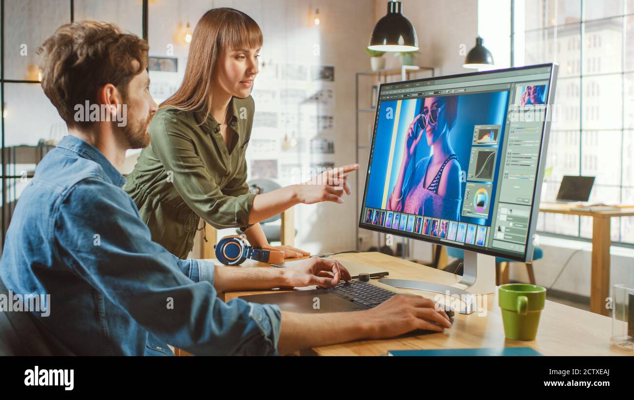 Female Art Director Consults Designer Colleague, They Work on a ...