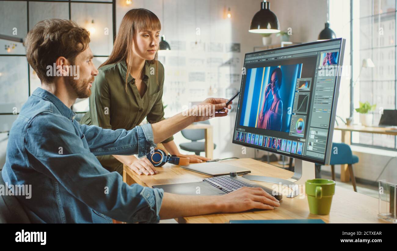 Female Art Director Consults Designer Colleague, They Work on a ...