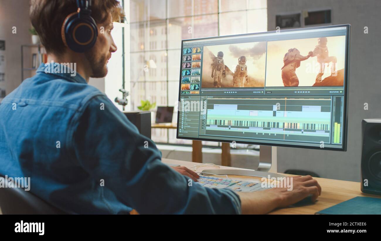 Male Video Editor in Headphones Working with Footages on His Personal ...