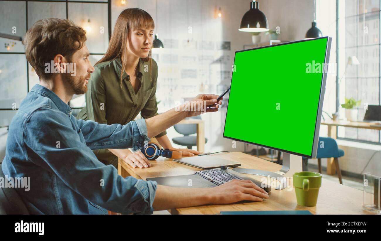 Female Art Director Consults Designer Colleague, They Work on a ...