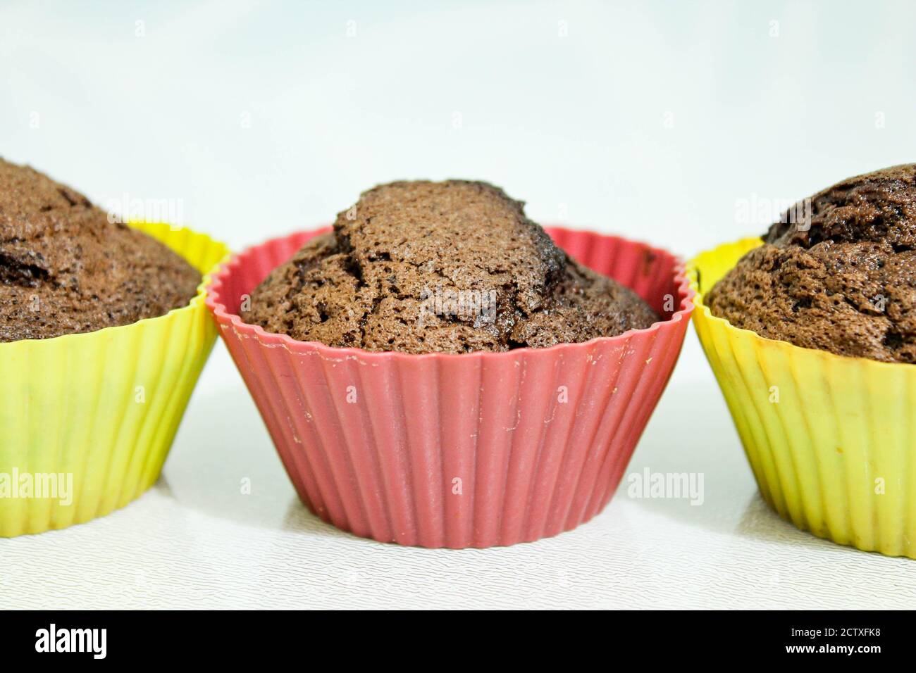 Baked muffins on a white table.Close -up Stock Photo - Alamy