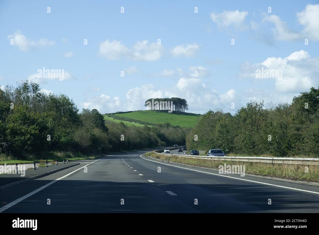 Coming home trees copse on the devon cornwall border A30 road Stock ...