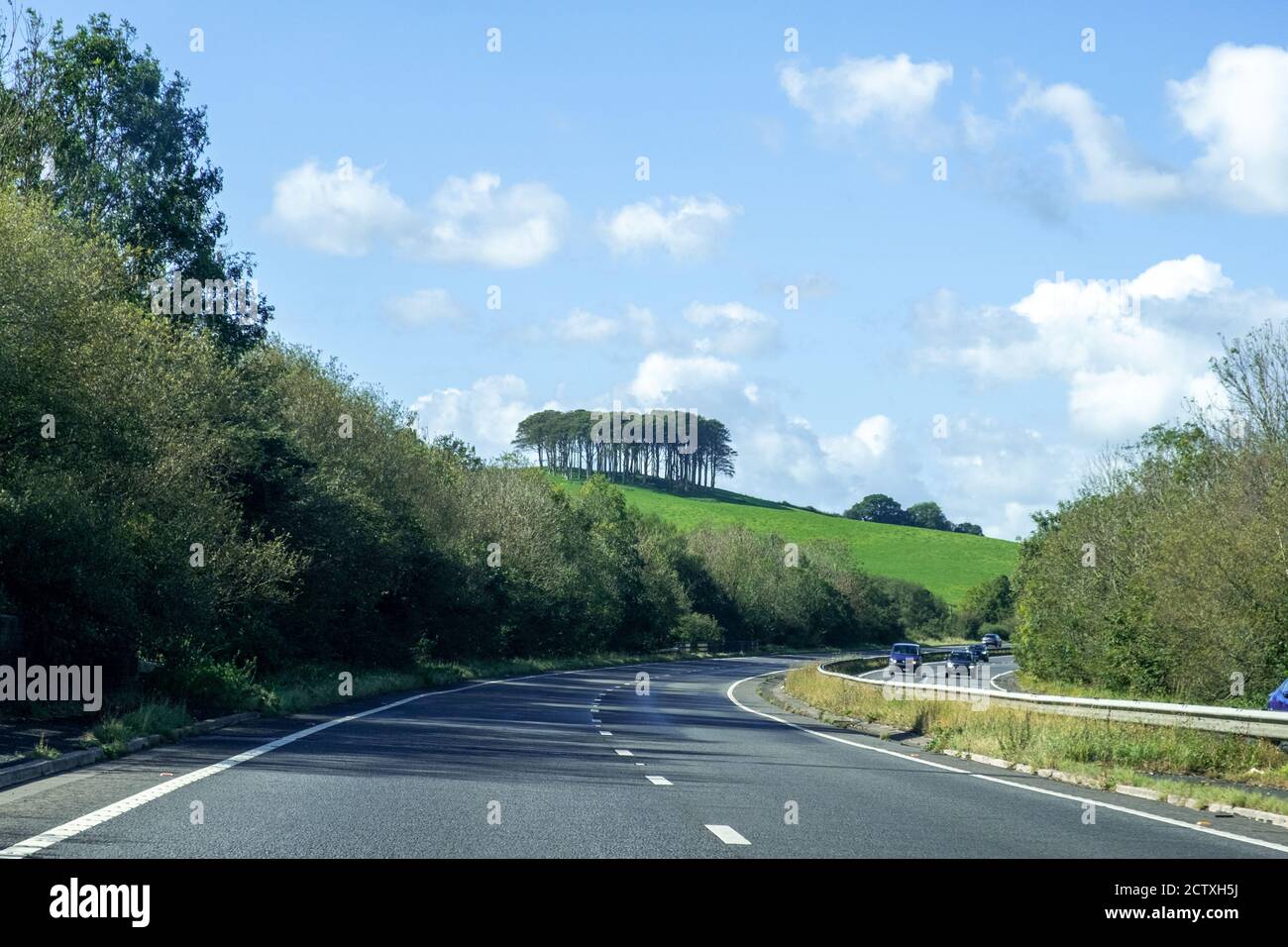 Coming home trees copse on the devon cornwall border A30 road Stock ...