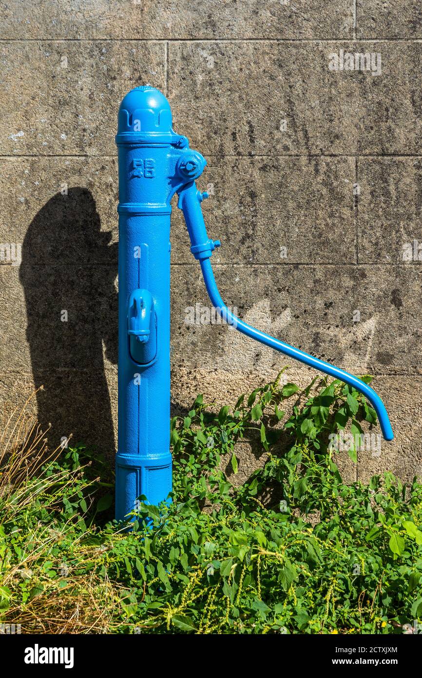 Blue painted water pump - La Souterraine, Creuse (23), France Stock ...