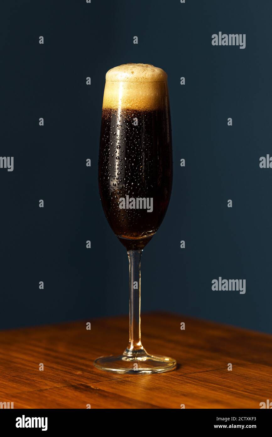 Black Velvet Cocktail. Stout Beer and Champagne. Cocktail on wooden bar ...