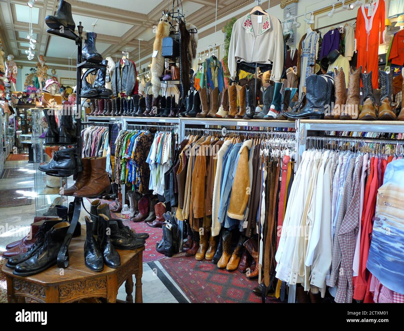 INTERIOR OF A SHOP SELLING ALL KINDS OF VINTAGE STYLE CLOTHING IN THE ...