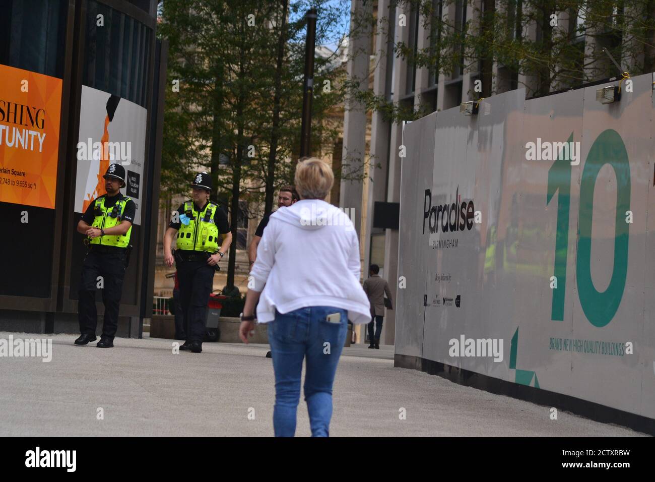 West Midlands Police and security officers walk on patrol near to ...