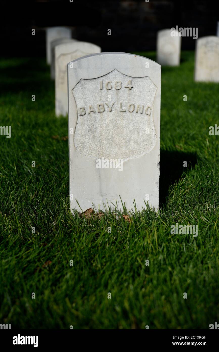 A 19th century marble tombstone inscribed simply with "Baby Long" is ...