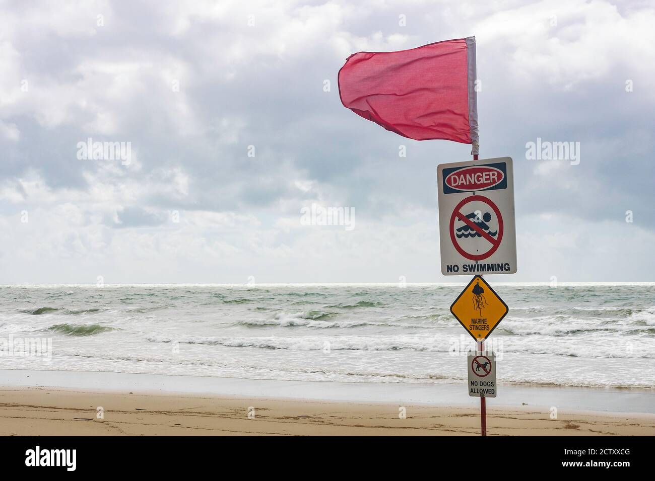 Queensland, Australia - March 18th, 2020: warning signs and a red flag ...