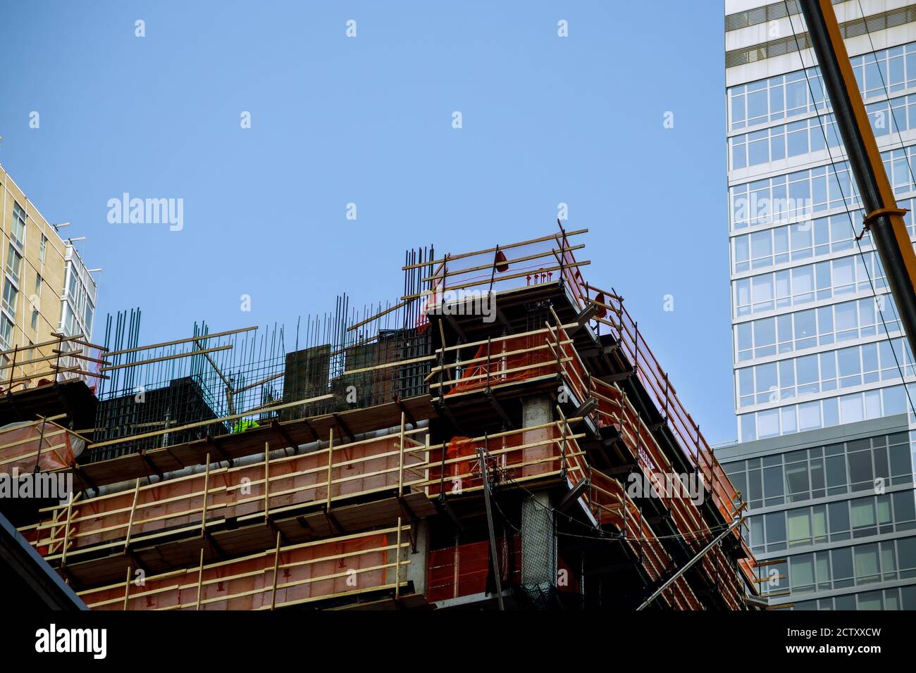 A construction worksite building in a big city residential skyscrapers ...