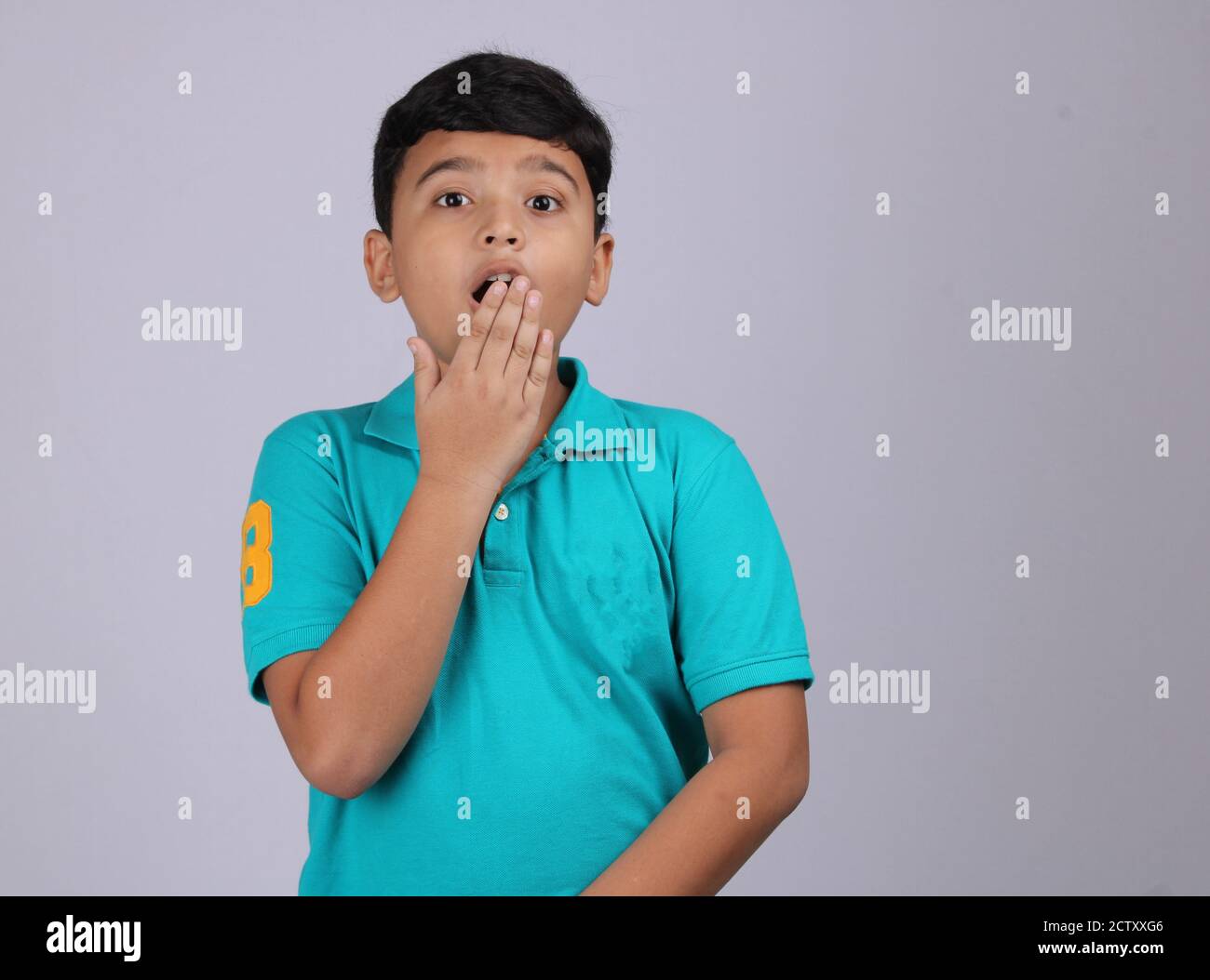 Boy with a shocked face expression. Isolated over white background ...
