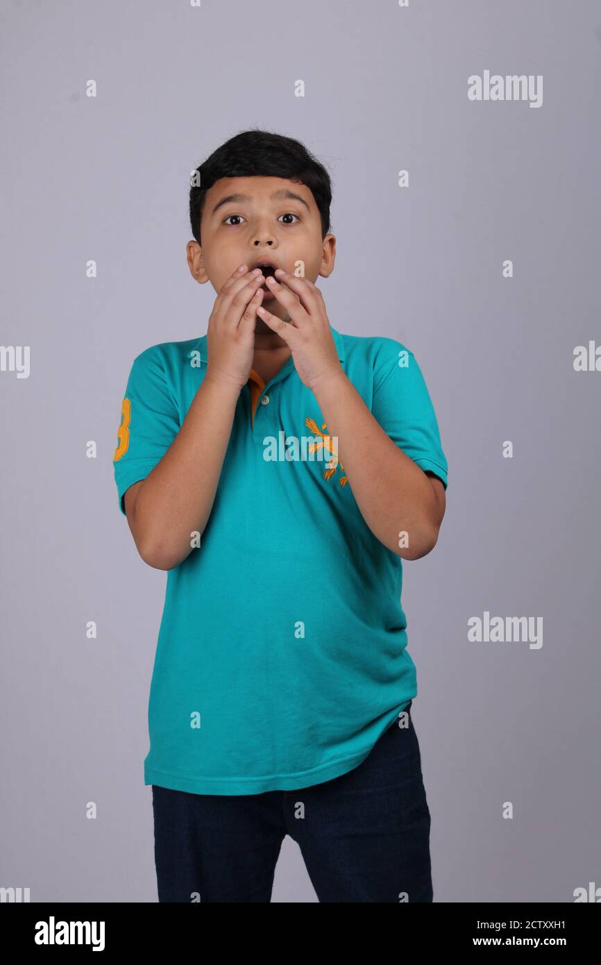 Boy with a shocked face expression. Isolated over white background ...