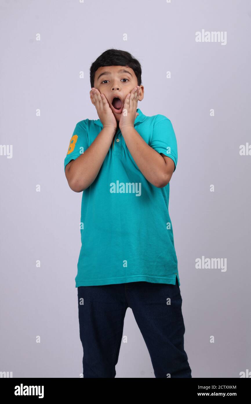 Boy with a shocked face expression. Isolated over white background ...