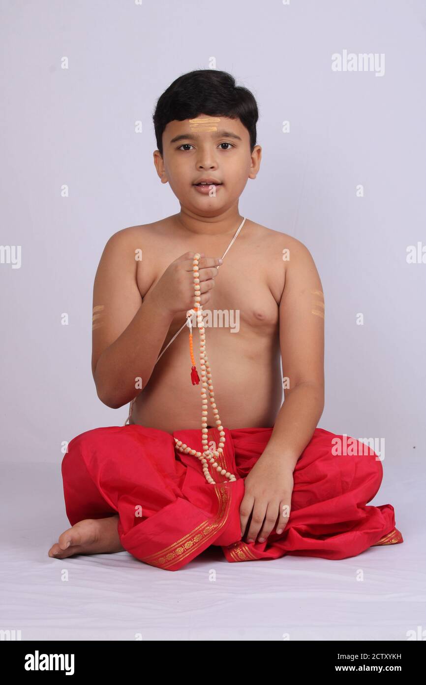 Young boy in Indian ethnic wear praying god. Namaste pose Stock Photo ...