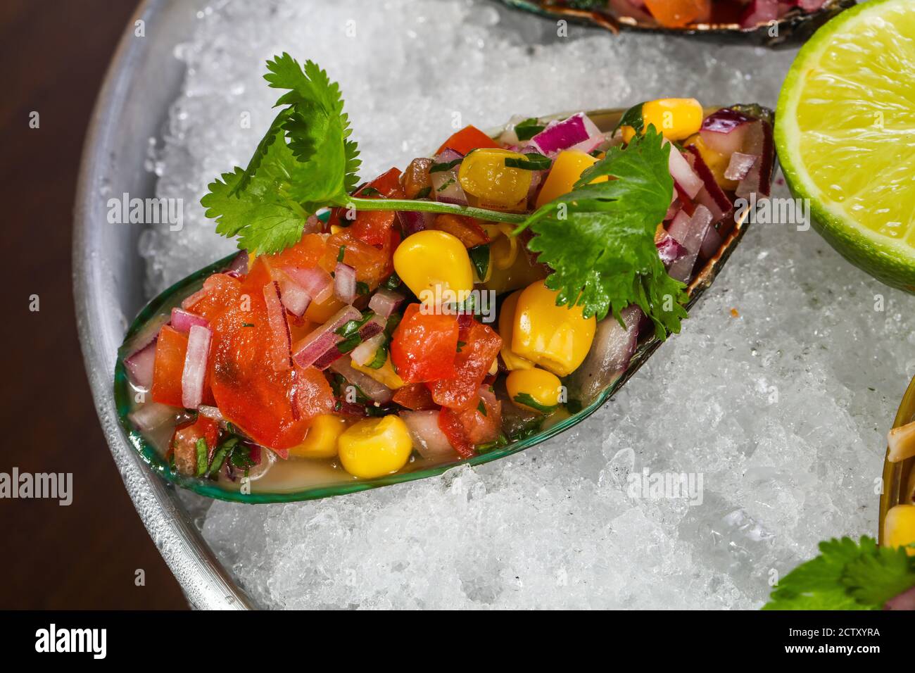 Boiled Mussels with vegetables and sauce Stock Photo - Alamy