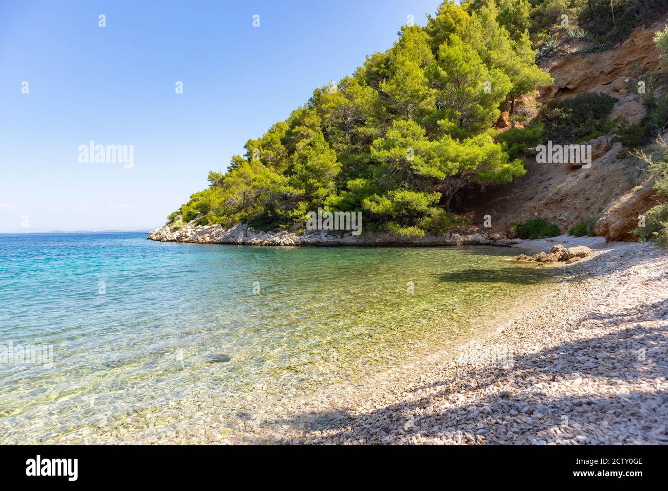 Steep hills covered in dense pine forest surrounding magnificent ...