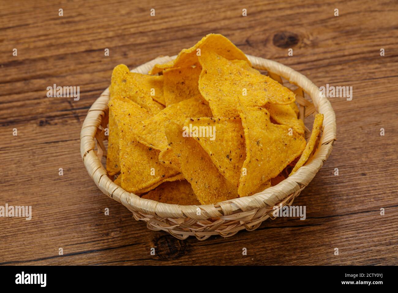 Mexican crunchy corn nachos triangle heap Stock Photo - Alamy