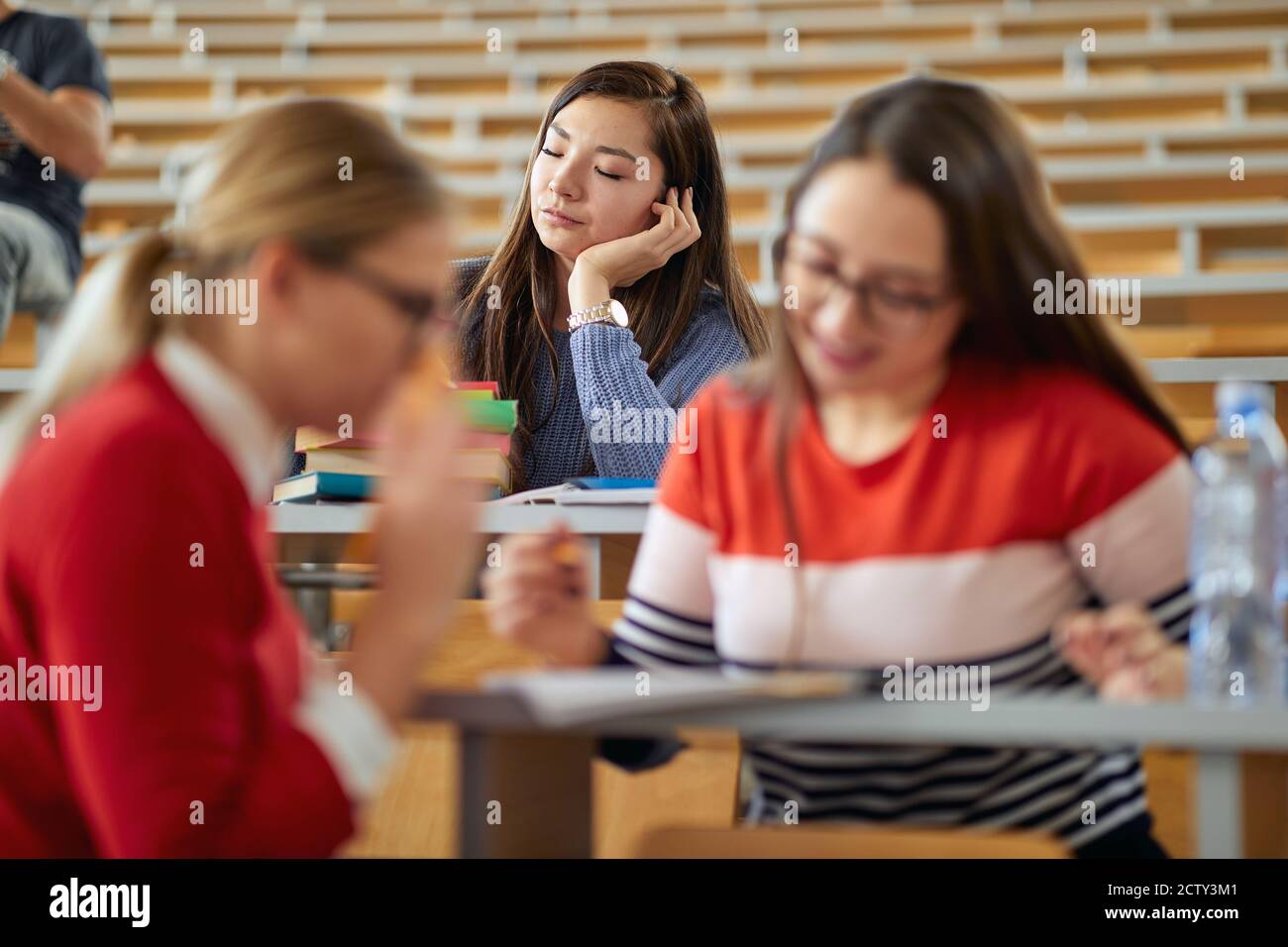 Female student taking a break from the lecture in the university ...