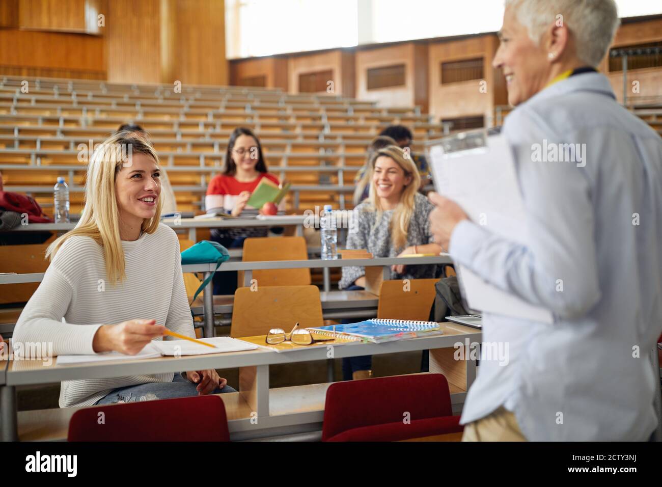 Teacher student talking standing board hi-res stock photography and ...
