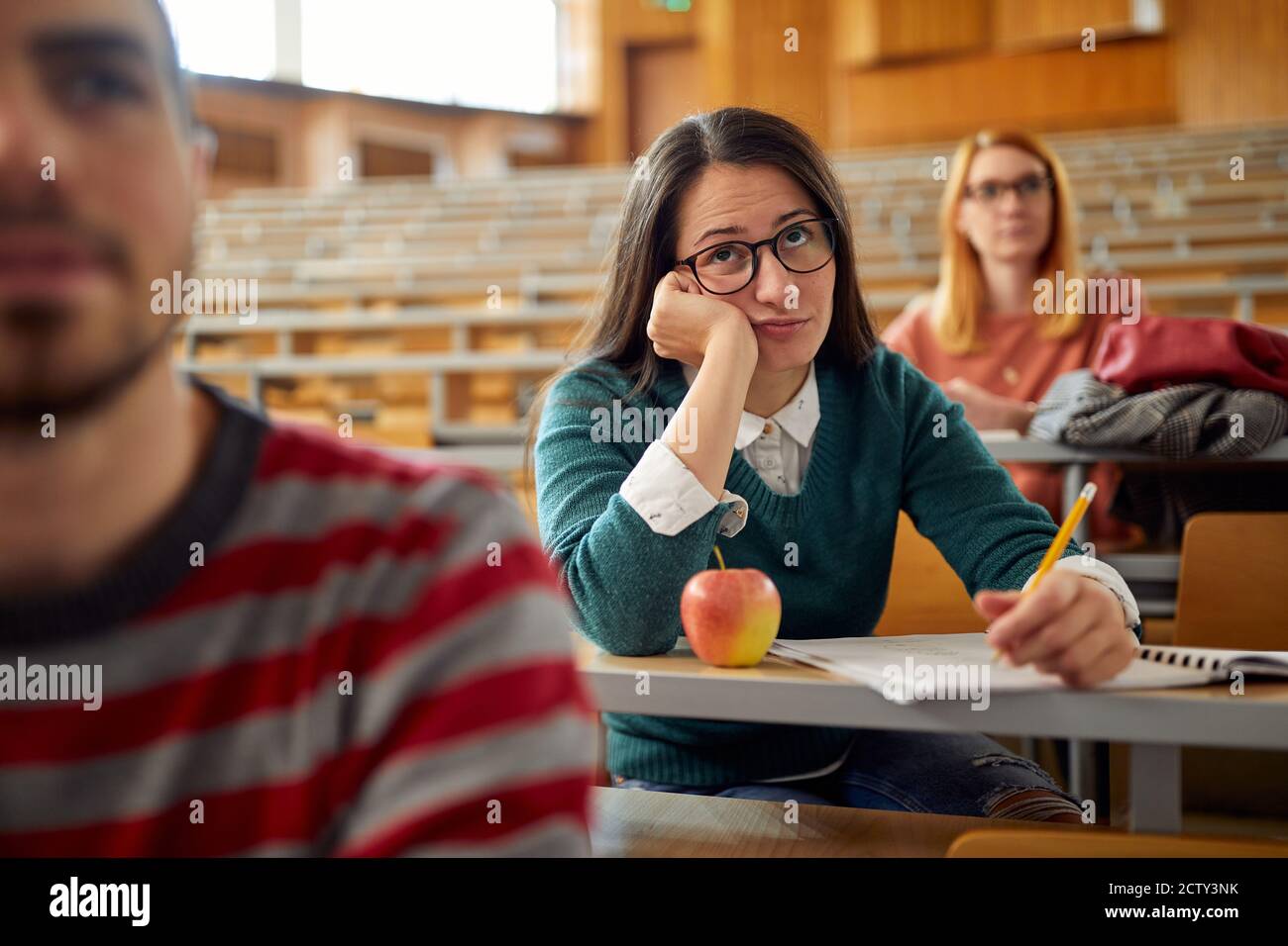 Girl bored in classroom hi-res stock photography and images - Alamy