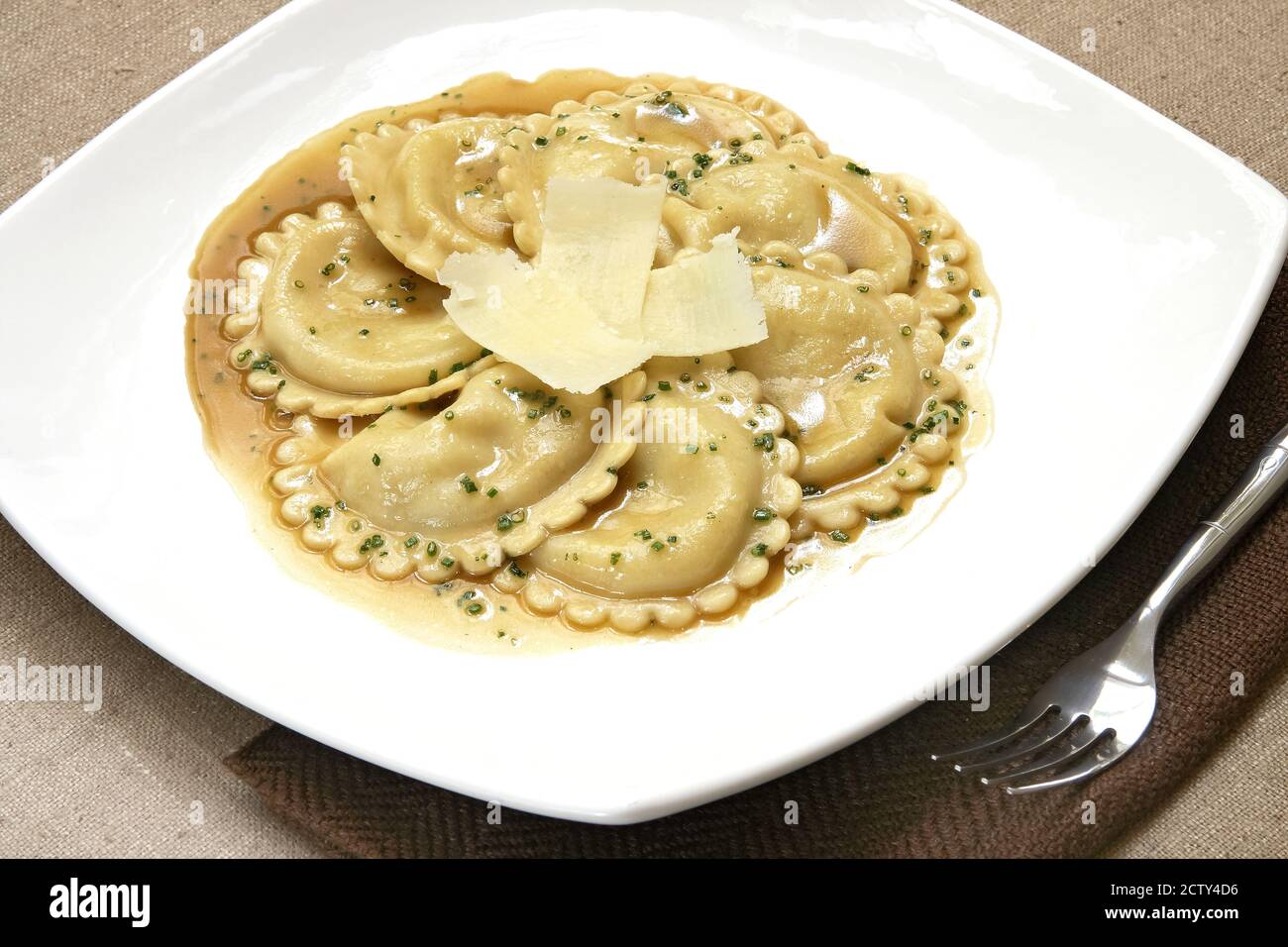 ravioli stuffed with duck meat, sauce and parmesan cheese Stock Photo ...