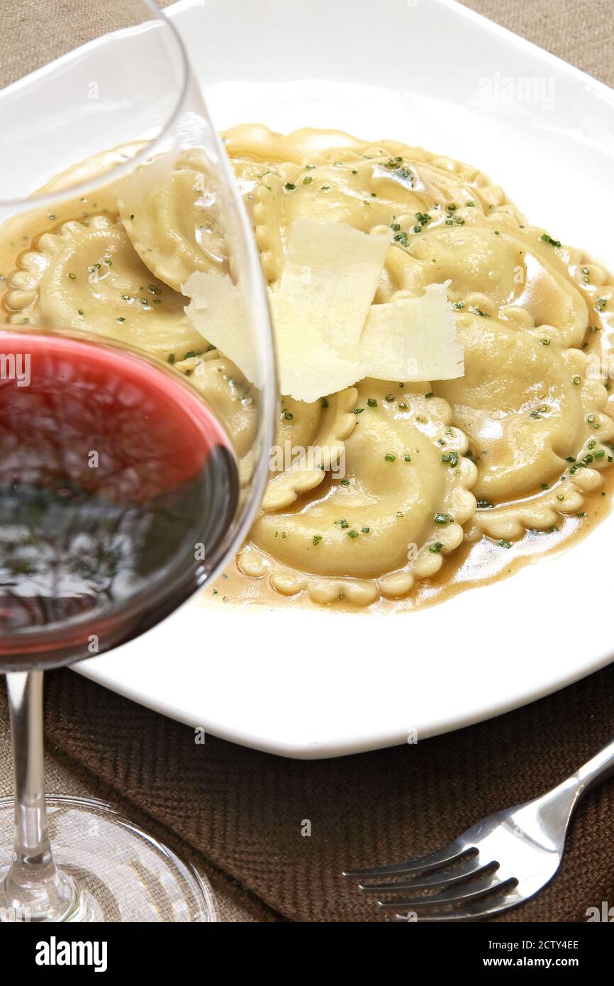 ravioli stuffed with duck meat, sauce and parmesan cheese Stock Photo ...