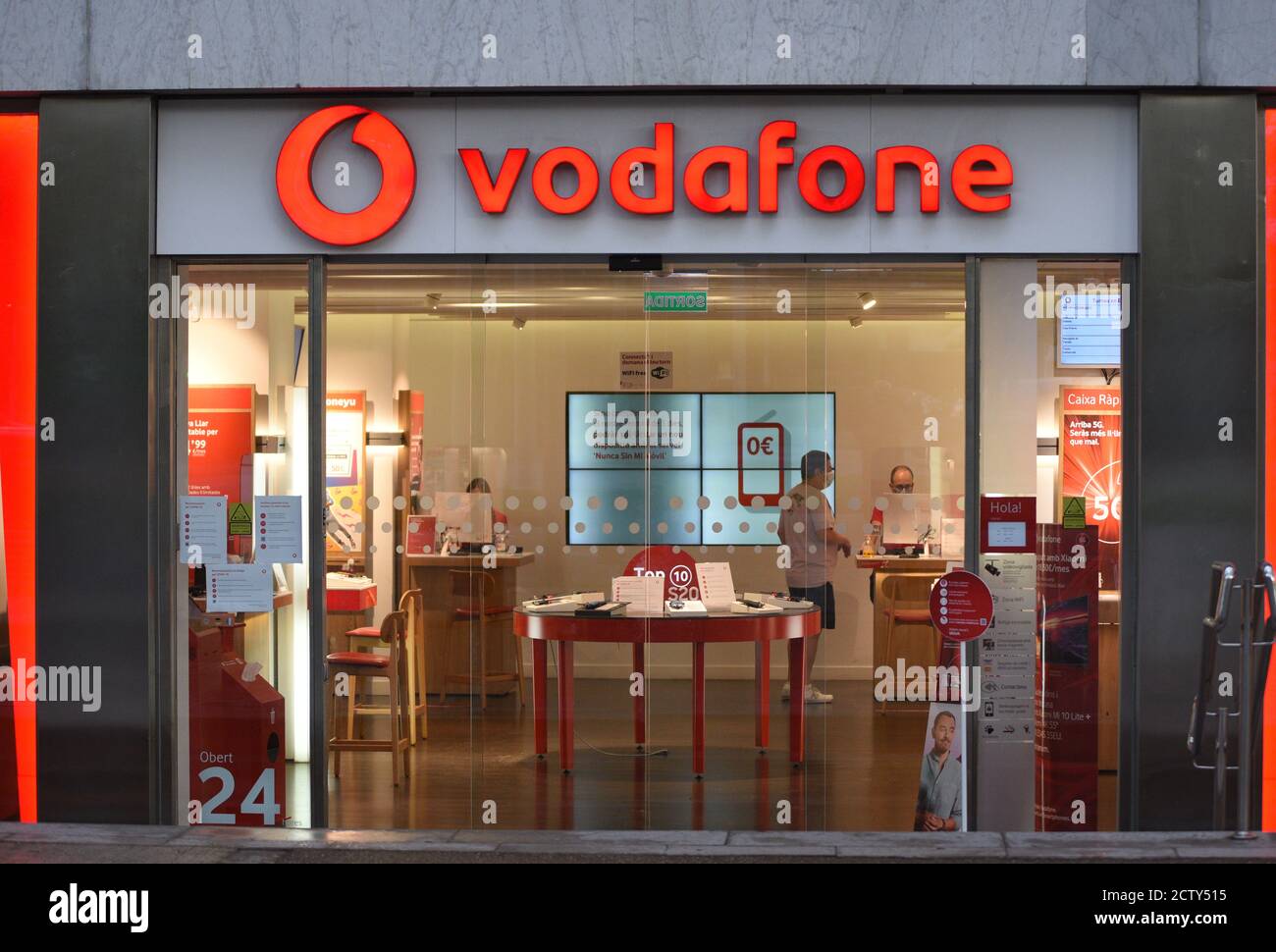 Vodafone logo seen at one of their stores Stock Photo - Alamy