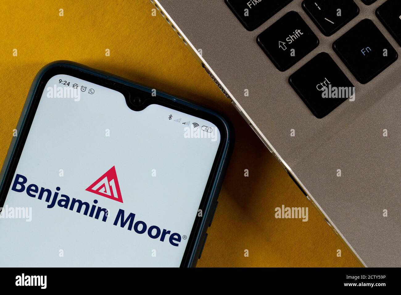 In this photo illustration the Benjamin Moore logo seen displayed on a ...