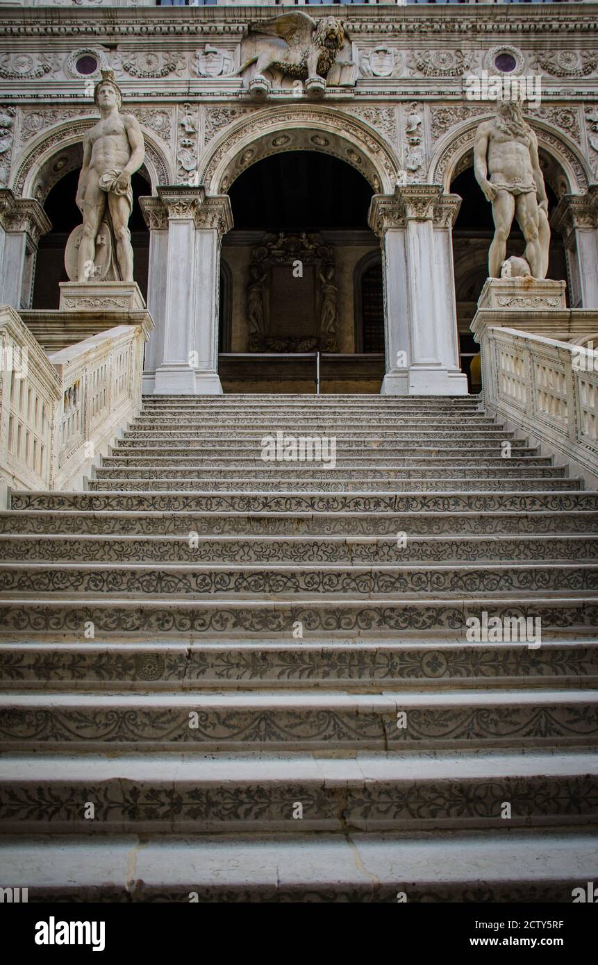 The massive staircase into the Doge Palace are flanked by statures of ...