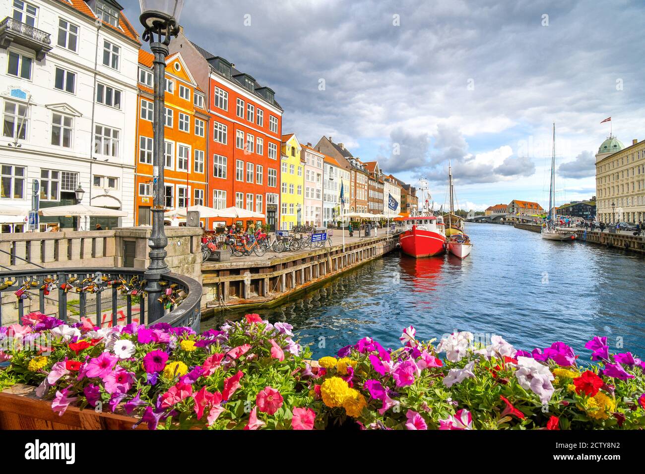 Padlocks and flower boxes line a bridge of the Nyhavn Canal in the ...