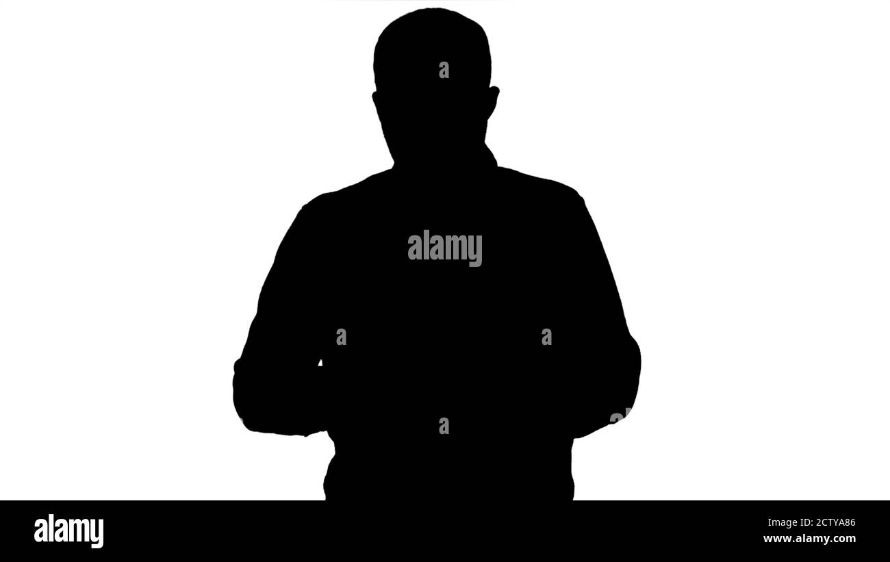 Silhouette Young business man using his tab walking Stock Photo - Alamy