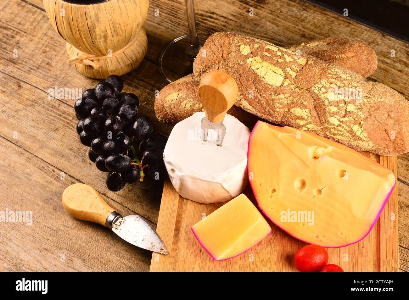 Table of mixed cheese and bread Stock Photo - Alamy
