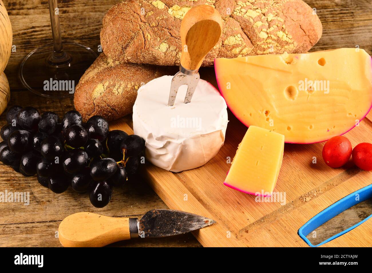 Table of mixed cheese and bread Stock Photo - Alamy