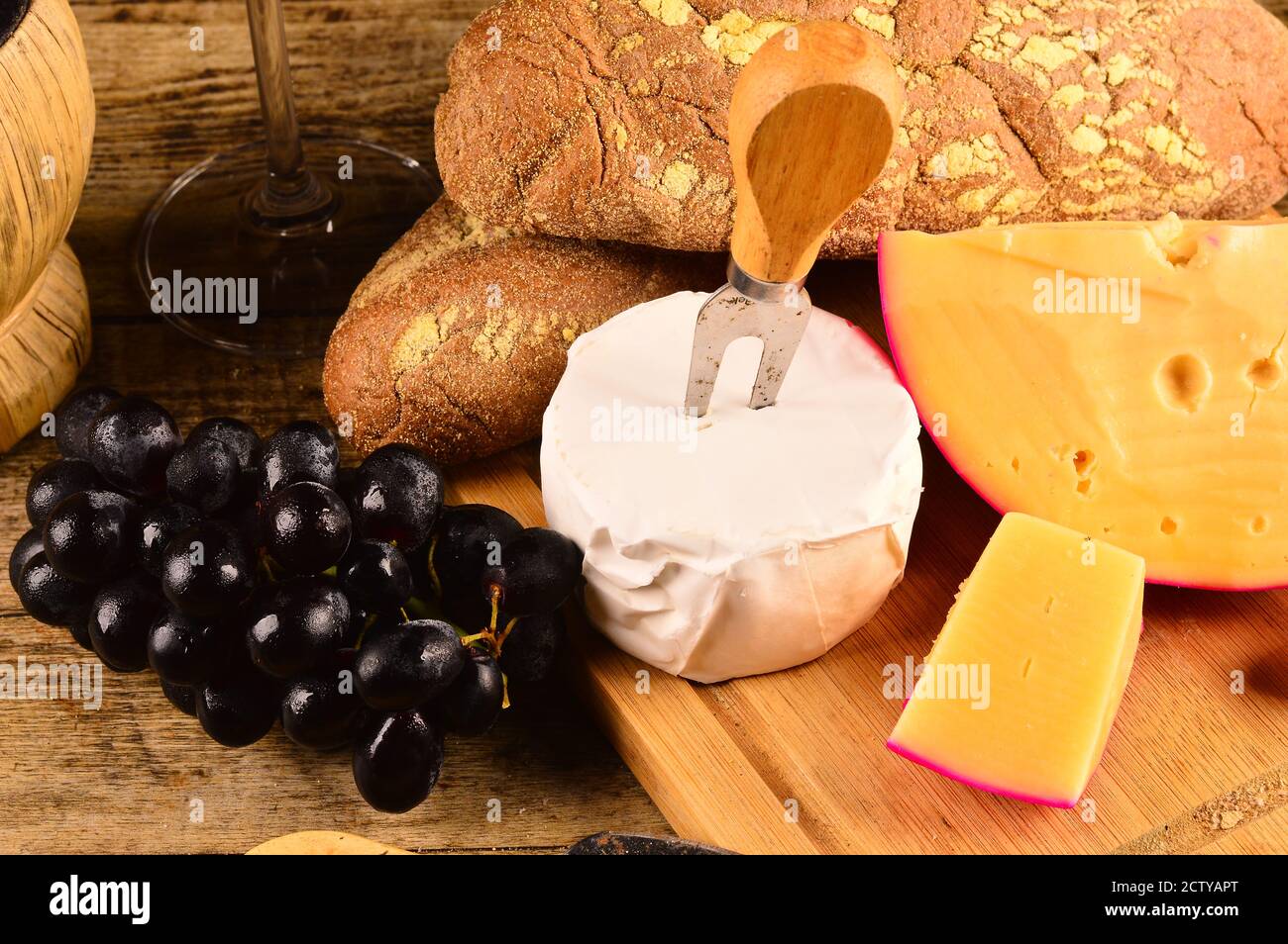 Table of mixed cheese and bread Stock Photo - Alamy