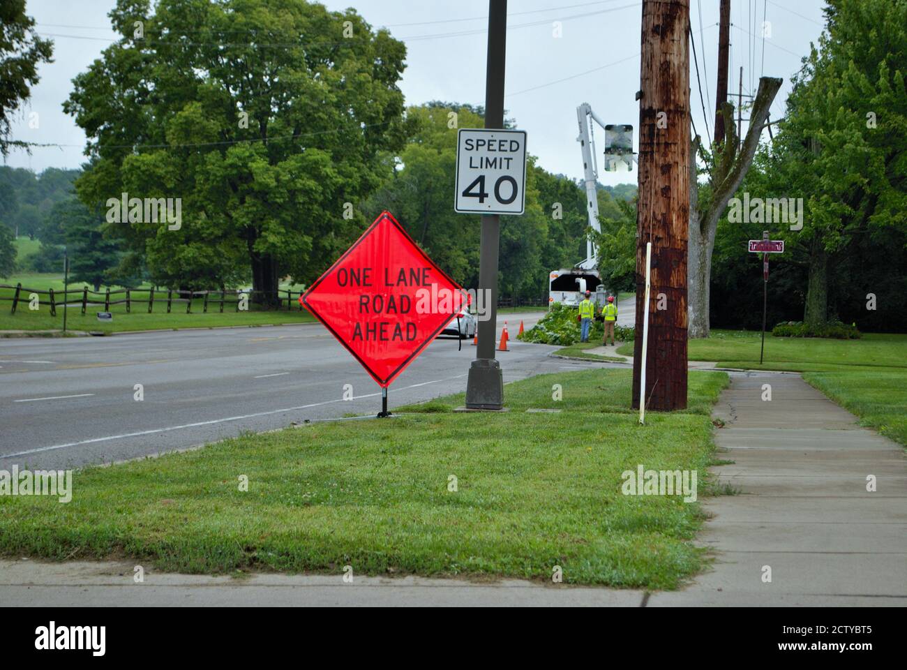One lane road ahead construction sign on the side of a five lane road ...