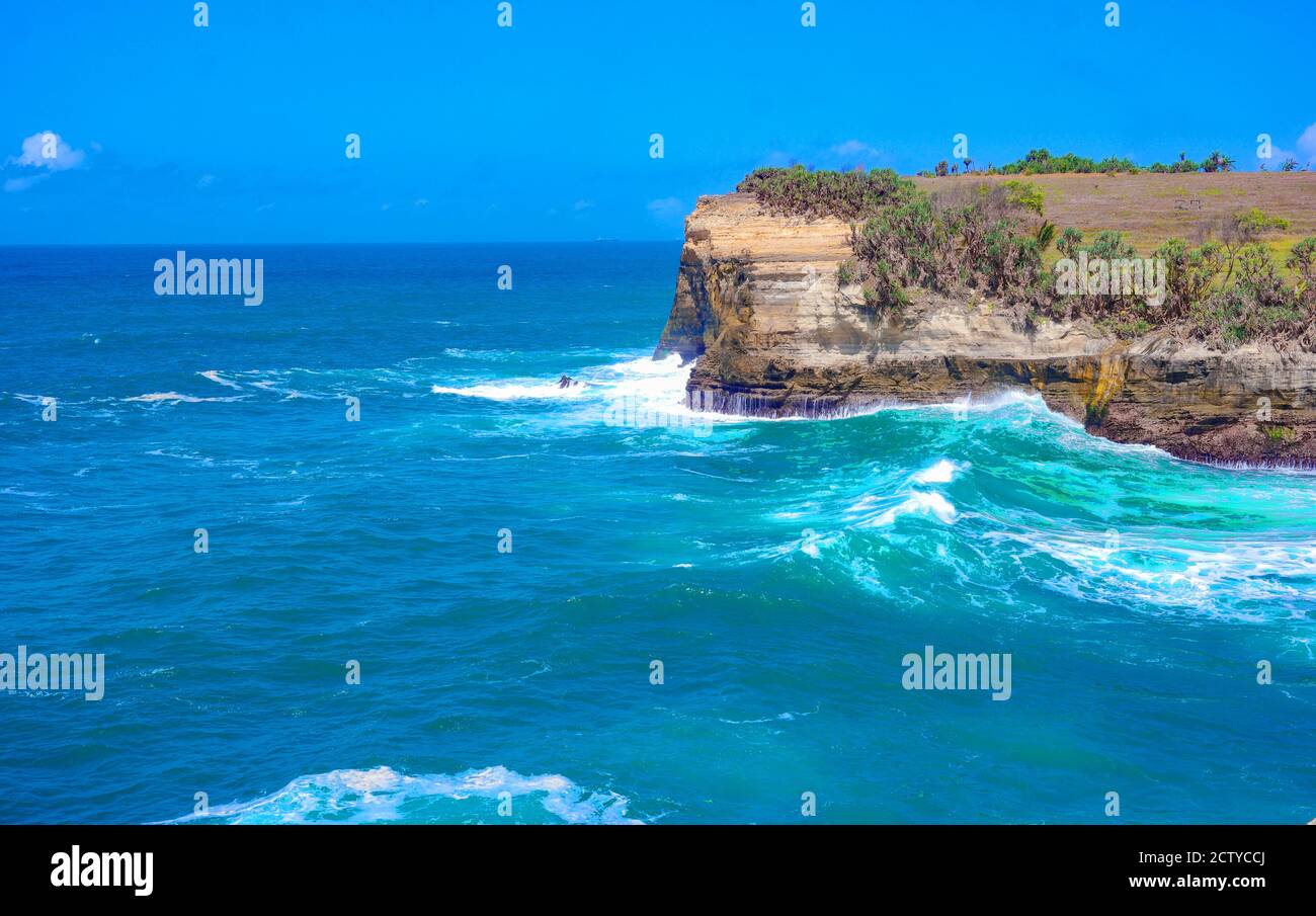 Beautiful ocean waves hitting the rocky cliffs - great for wallpapers ...