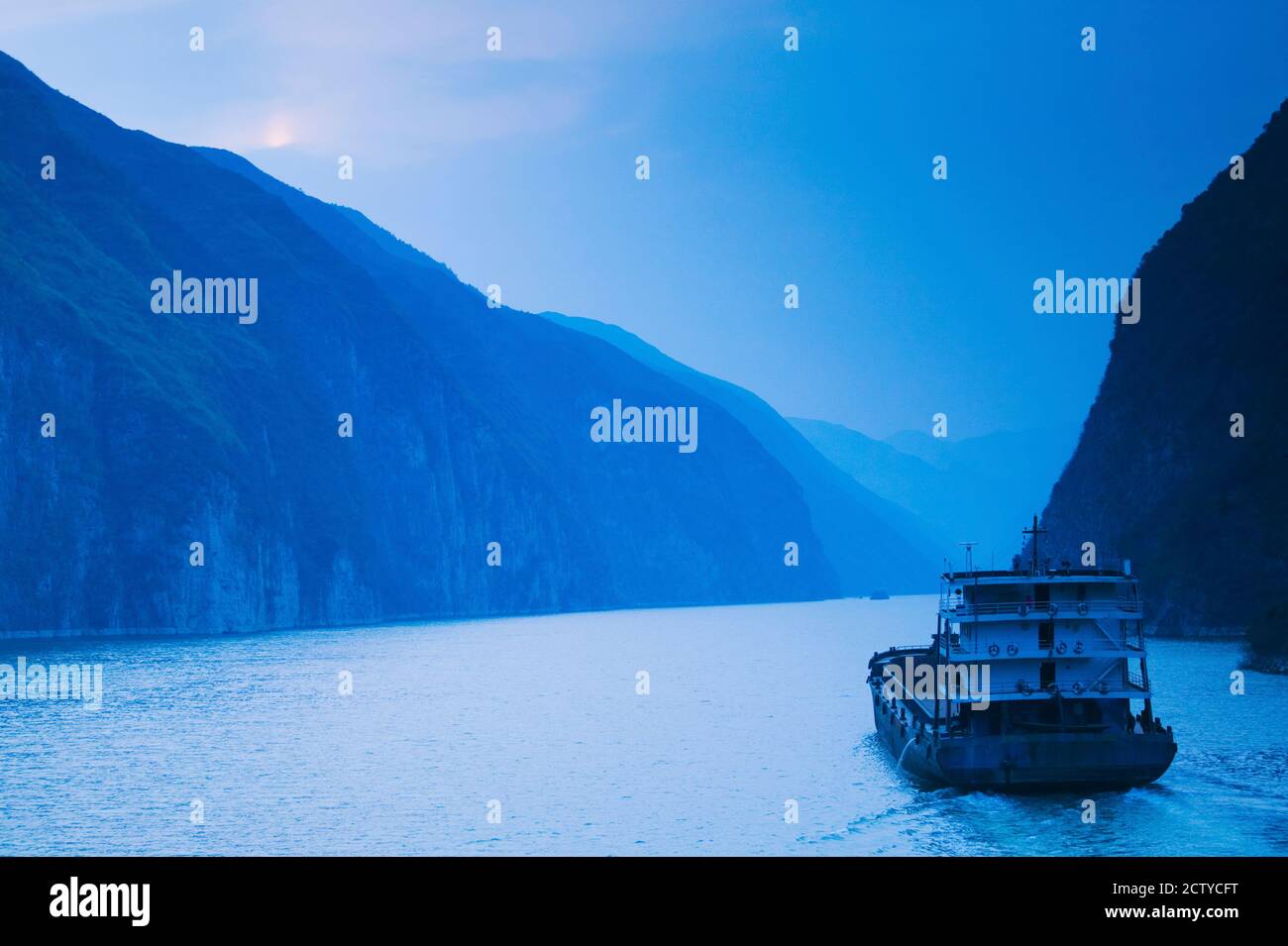 Container ship in the river at sunset, Wu Gorge, Yangtze River, Hubei ...