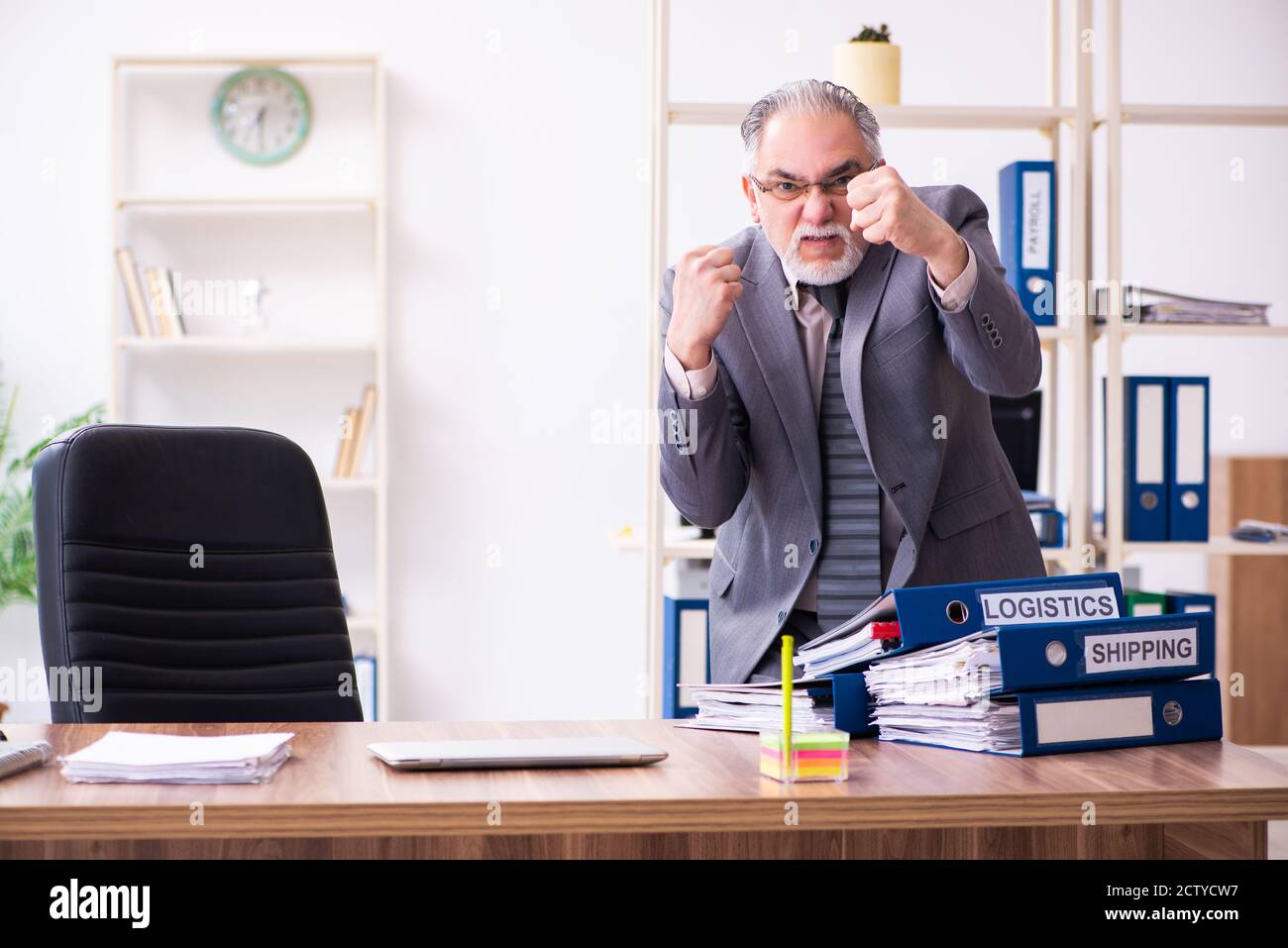Businessman angry and furious at his workplace Stock Photo - Alamy